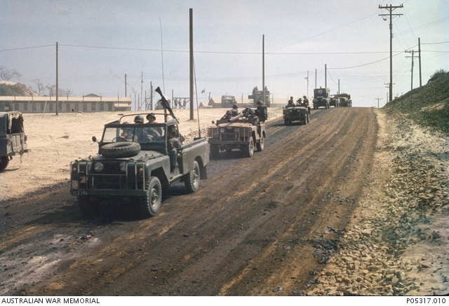 A convoy of Australian vehicles leaving the compound at Vung Tau bound ...