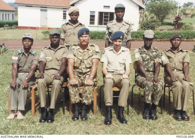 Group portrait of Warrant Officer Class 2 (WO2) Gary Hunter (front row ...
