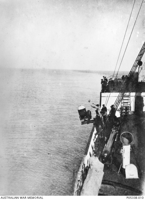 A sea mine is launched by an unidentified sailor from the German armed ...