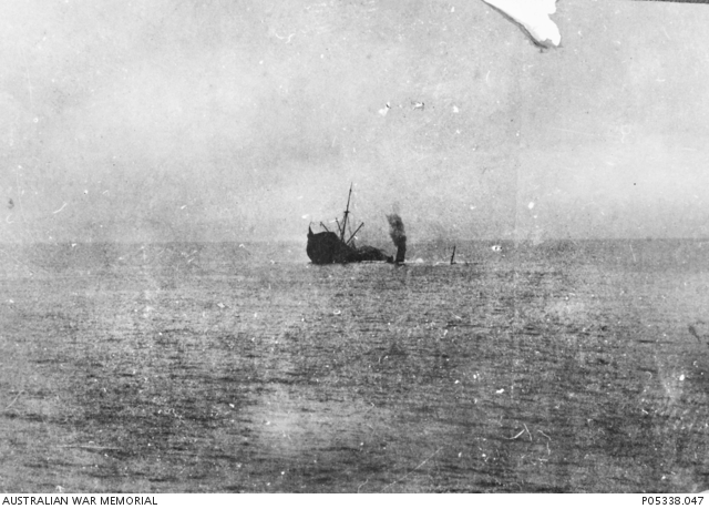 The 4152 ton British merchant ship, Jumna, sinking, her bow and funnel ...