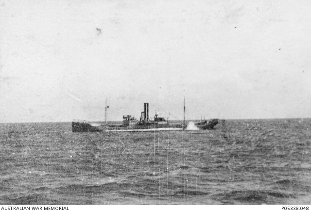 Explosive charges are detonated aboard the 3509 ton British merchant ...