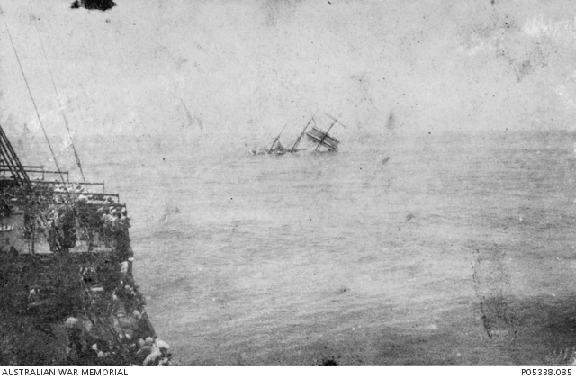 Sailors crowd the rails of the German armed merchant raider, SMS Wolf ...