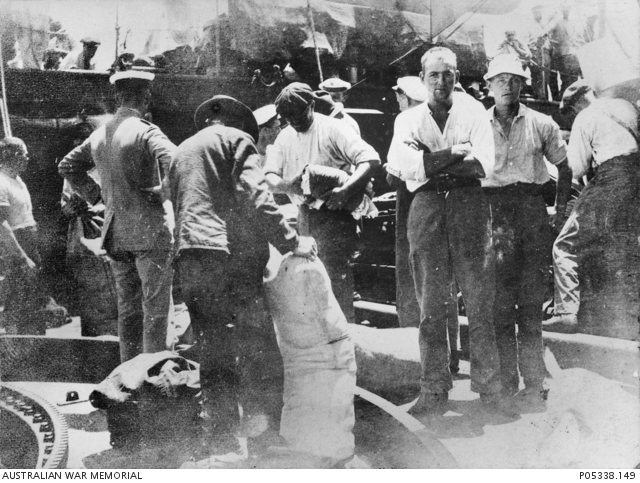 A group of unidentified sailors aboard the German armed merchant raider ...