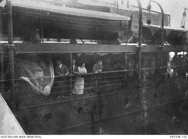 Passengers line the railings of the 6557 ton Japanese freighter ...