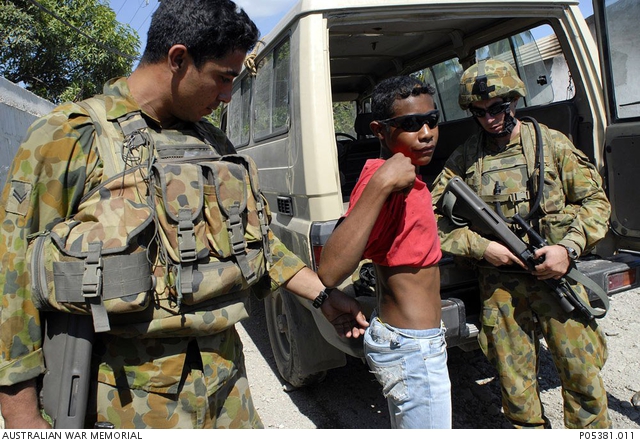 Unidentified Australian soldiers, armed with Steyr F88 assault rifles ...