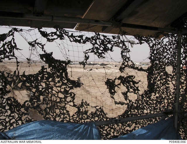 Helicopters and buildings looking north within Camp Smitty seen through ...