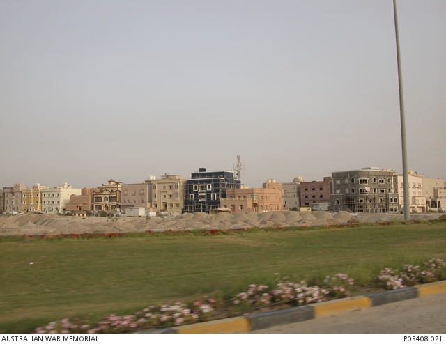 Houses and buildings under construction en route from Kuwait City to ...
