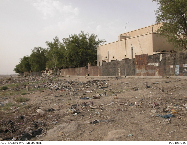 Dogs scavanging amongst the rubbish in the almost deserted railway ...