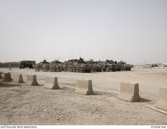 Australian armoured supply vehicles parked in the transport area of ...