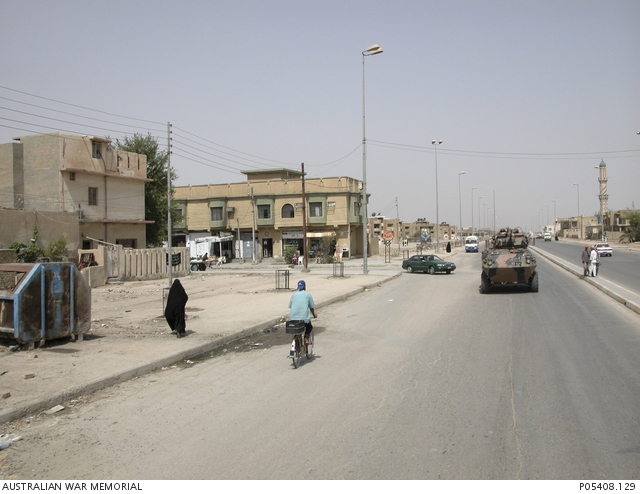 An Australian Light Armoured Vehicle (ASLAV) undertaking a patrol with ...