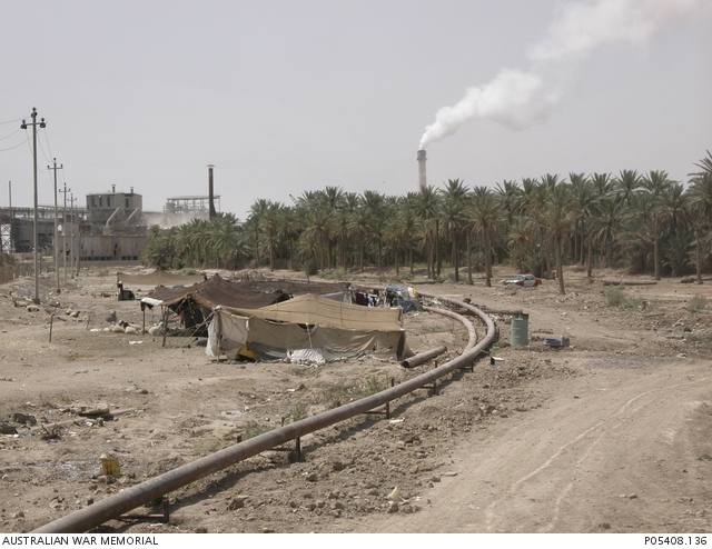 Makeshift Bedouin slum housing situated next to an oil pipeline in the ...