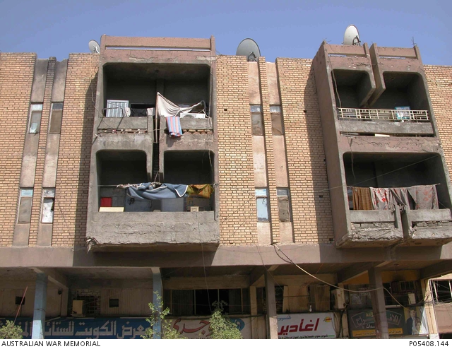 An apartment building in the town of As Samawah. Note the satellite ...