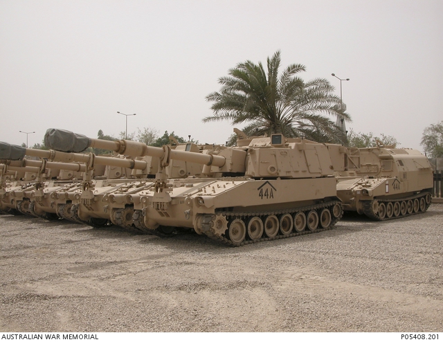 American M109A6 Paladin self propelled howitzers with ammunitions carriers at Camp Union, where ...