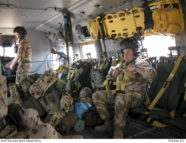 Unidentified British and Australian soldiers seated in the rear of a ...