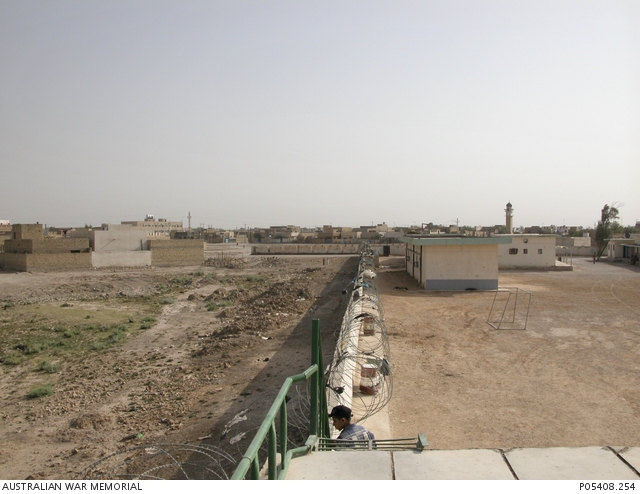The barbed wire perimeter fence of the 603rd Battalion, Iraqi Army ...