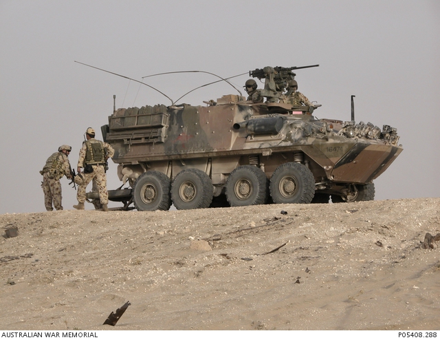 Australian soldiers boarding an Australian Light Armoured Vehicle ...