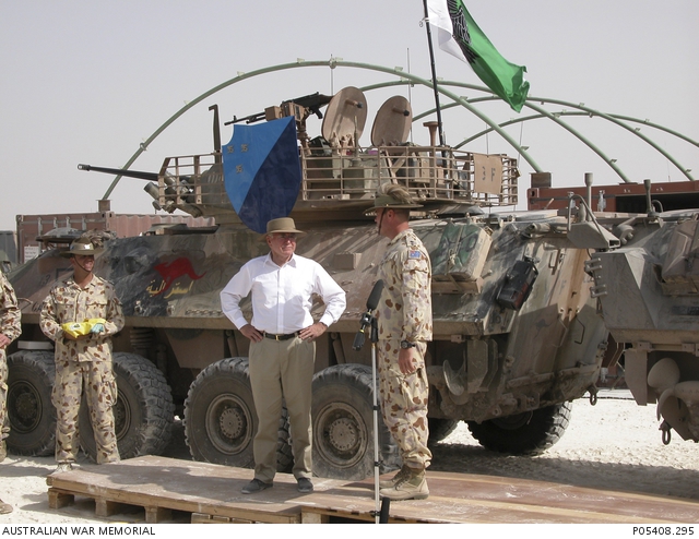 Colonel Noble (right) speaks with Australian Prime Minister John Howard ...