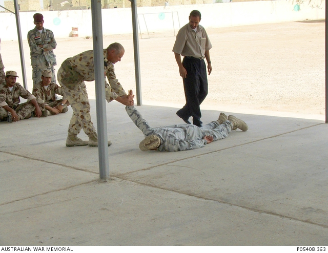 Warrant Officer Class 1 (WO1) Greg Westhead demonstrates the correct ...