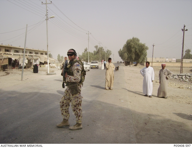 Warrant Officer Class 1 Greg Westhead providing security for members of ...
