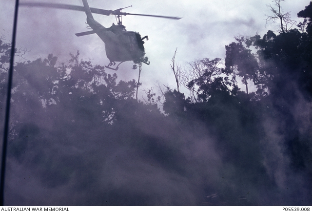 Distinguished by a red cross on its side, an Iroquois dust-off ...