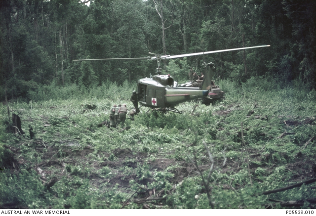 Distinguished by a red cross on its side, an Iroquois dust-off ...