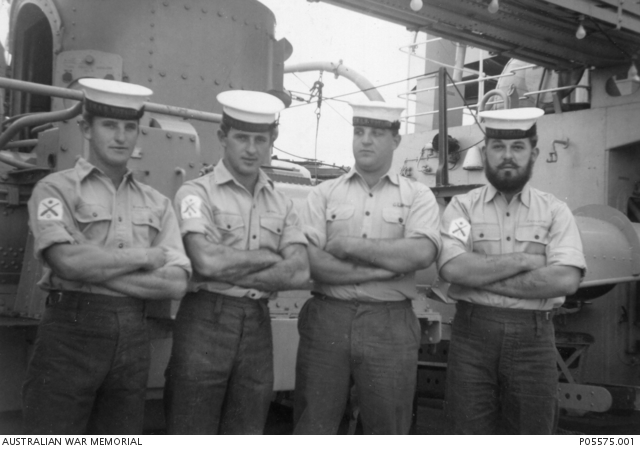 Four sailors dressed for the Captain's Divisions on HMAS Voyager II at ...