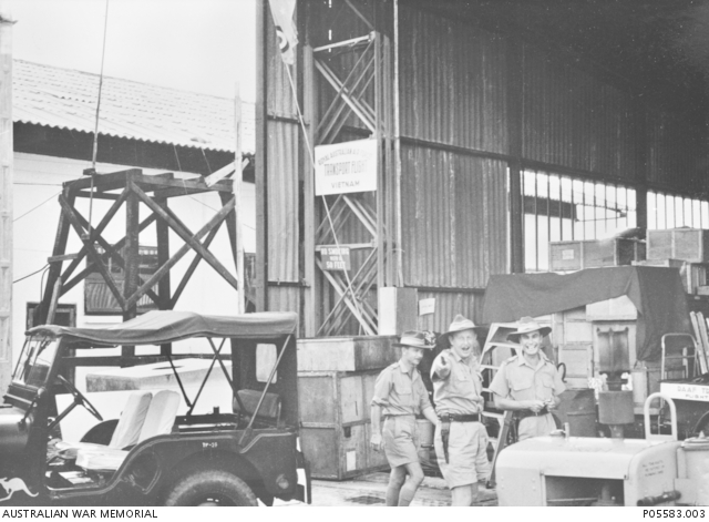 Three RAAF officers standing at the corner of the RAAF Transport Flight ...
