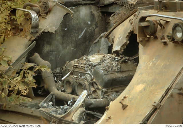 A mass of wreckage lies inside a burned out M113A1 armoured personnel ...