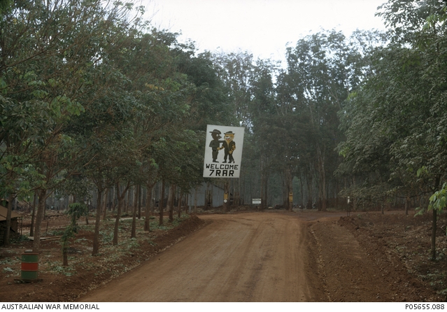Welcome sign at camp, displaying the unofficial mascots of 7RAR (Pig ...
