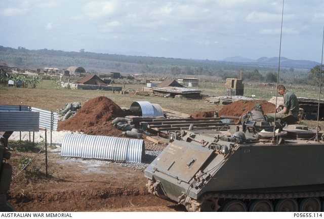 Bunker under construction at Nui Dat. In the foreground stands M113A1 ...