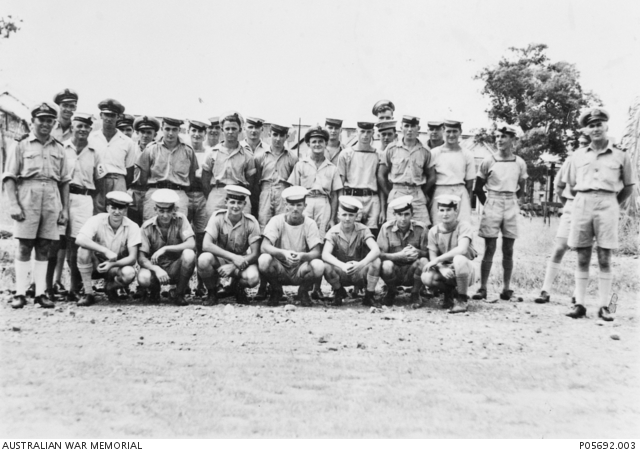 Informal outdoor group portrait of crew members of RAN Boom Defence ...
