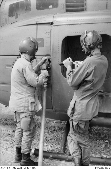 Specialist 5 (SP5) Rogers (left) and an unidentified gunner, both of ...
