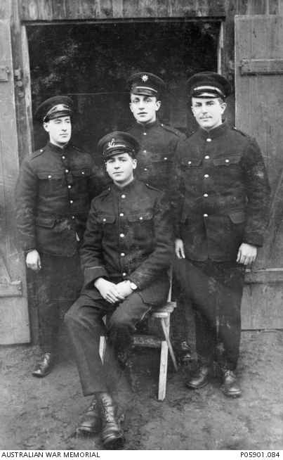 Outdoor portrait of four allied Prisoners of War (POW) at a POW camp at ...