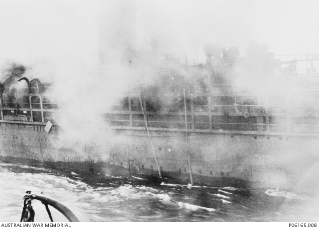 View from HMAS Quiberon as she pulls alongside the heavily damaged SS ...