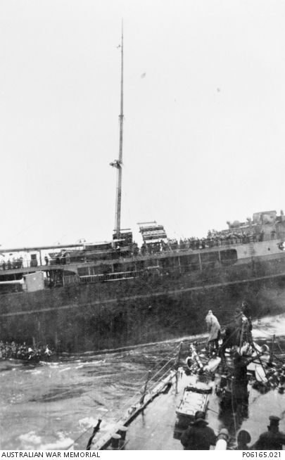 Crewmembers waiting to evacuate the HM Comorin as seen from the British ...