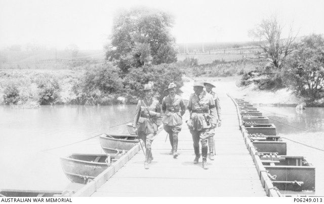 Officers Stroll Across A Pontoon Bridge Recently Completed By