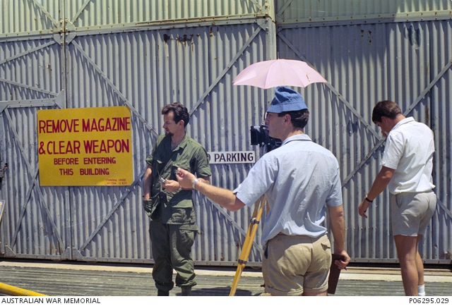 The three members of the Commonwealth Film Unit outside the 9 Squadron ...
