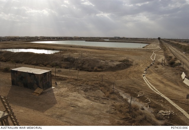 Approaching sandstorm, view from watchtower at base perimeter, military ...