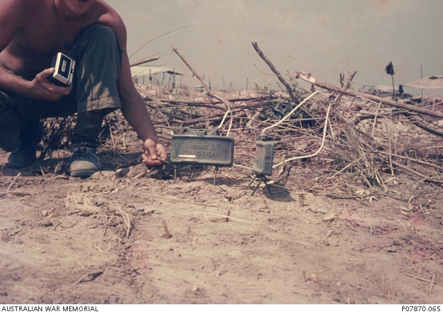 Sapper showing an M-19 Claymore directional fragmentation mine ...