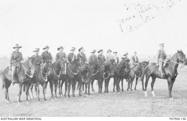 Outdoor portrait of thirteen members of the 6th Light Horse Regiment ...