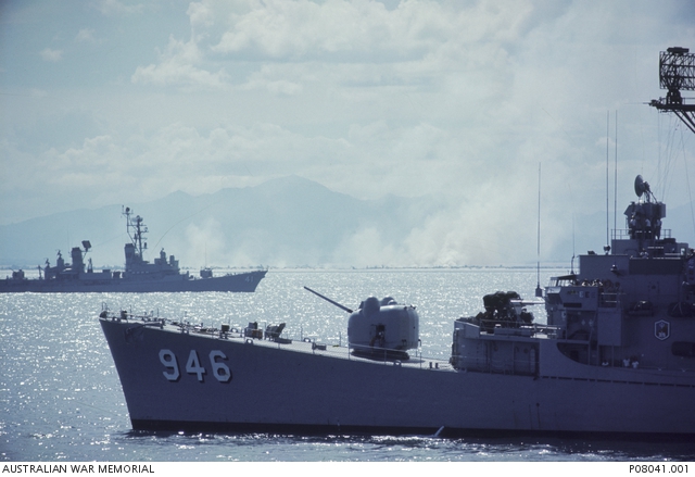 RAN guided missile destroyer HMAS Brisbane (II) D41 (background), and ...