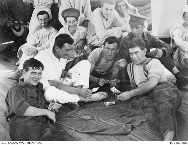 Members of the Australian Army Medical Corps (AAMC) playing cards on ...