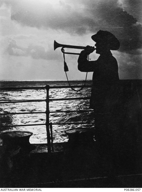 The Last Post at sunset aboard the troopship HMAT Euripides (A14). The ...