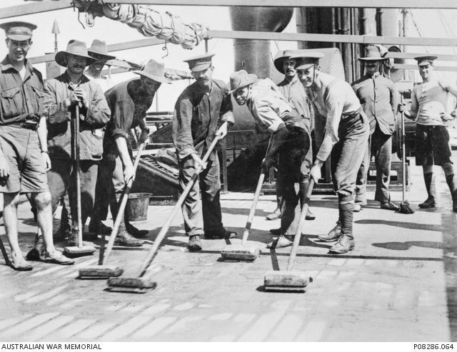 Cleaning the decks aboard the troopship HMAT Euripides (A14). The ...