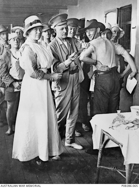 Inoculations aboard the troopship HMAT Euripides (A14). The photograph ...
