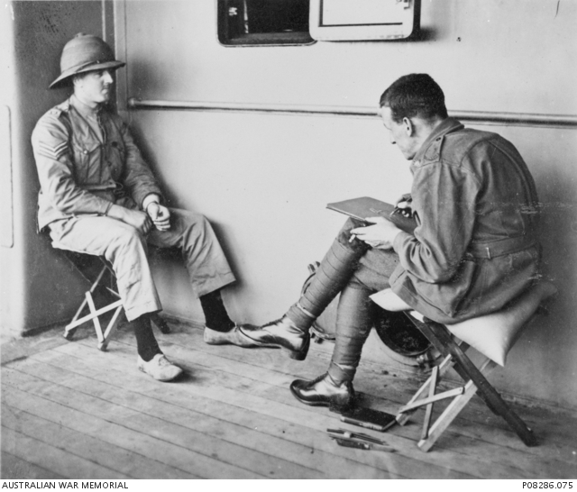 A soldier drawing a portrait of a corporal aboard the troopship HMAT ...