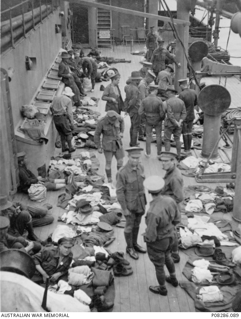 Kit inspection on deck aboard the troopship HMAT Euripides (A14). The ...