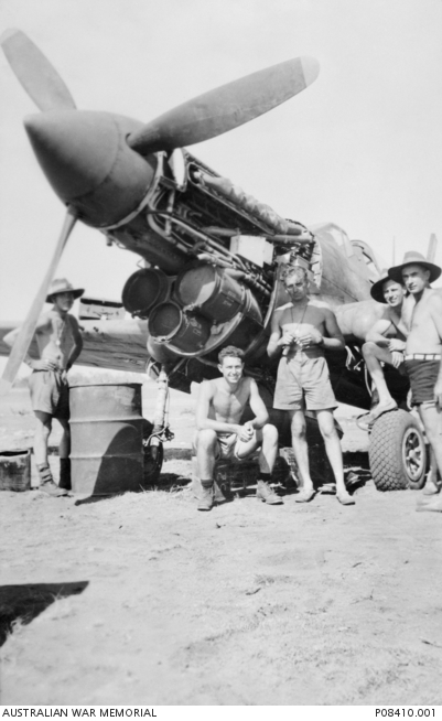 Informal outdoor portrait of members of the RAAF standing in front of a ...
