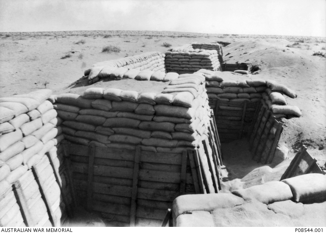A trench in the Suez Canal Zone, showing revetments, sand bagged ...