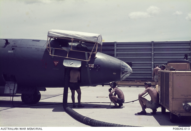 RAAF ground crew performing final checks on 2 Squadron Canberra bomber ...